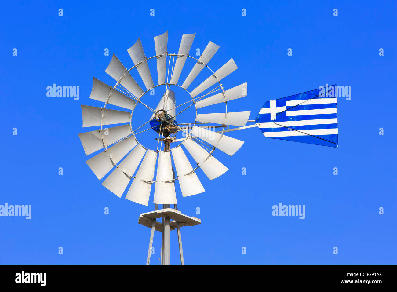 A windpump (type of windmill) with the Greek flag in Protaras, Cyprus ...