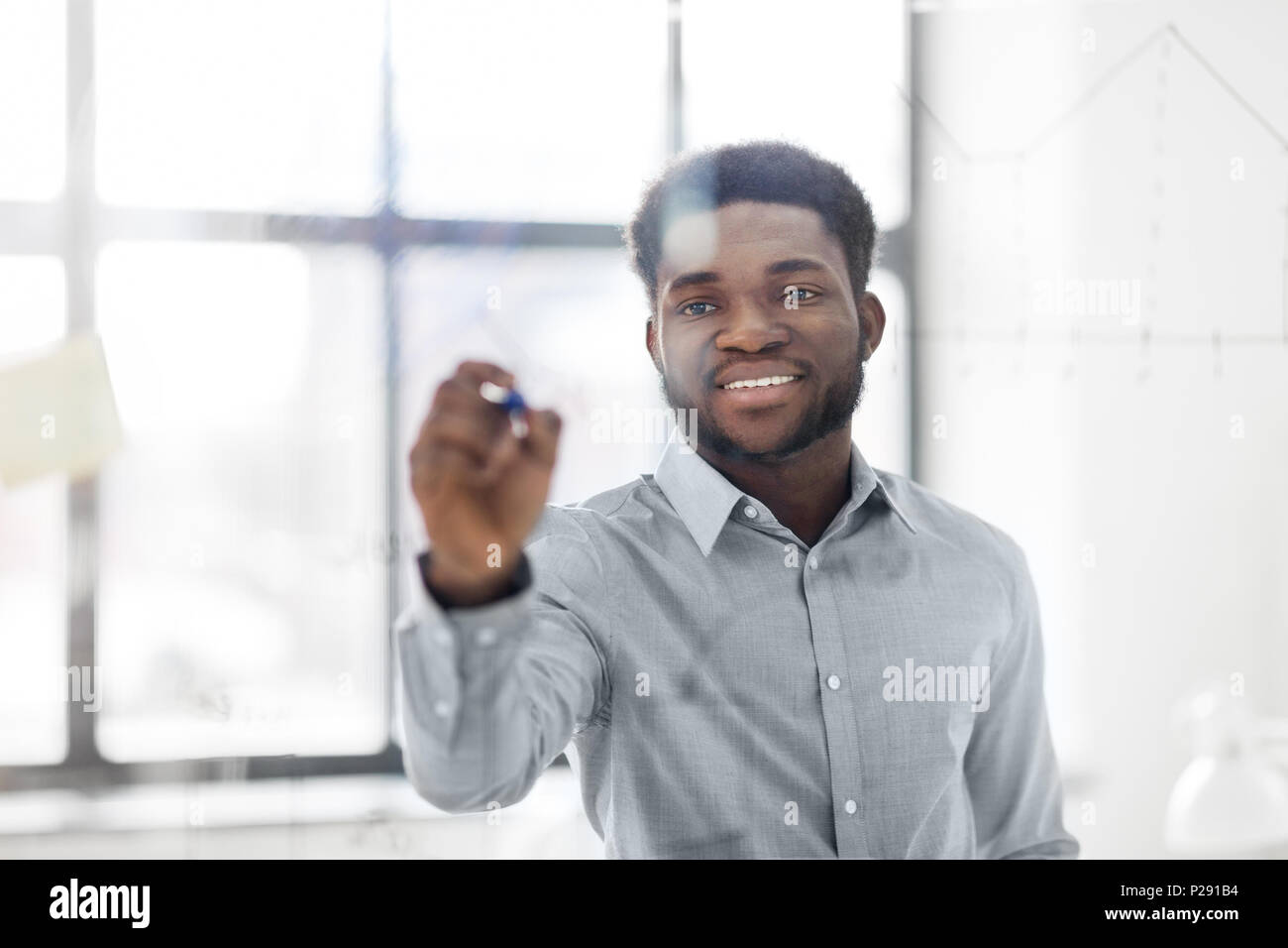 Businessman writing glass hi-res stock photography and images - Alamy