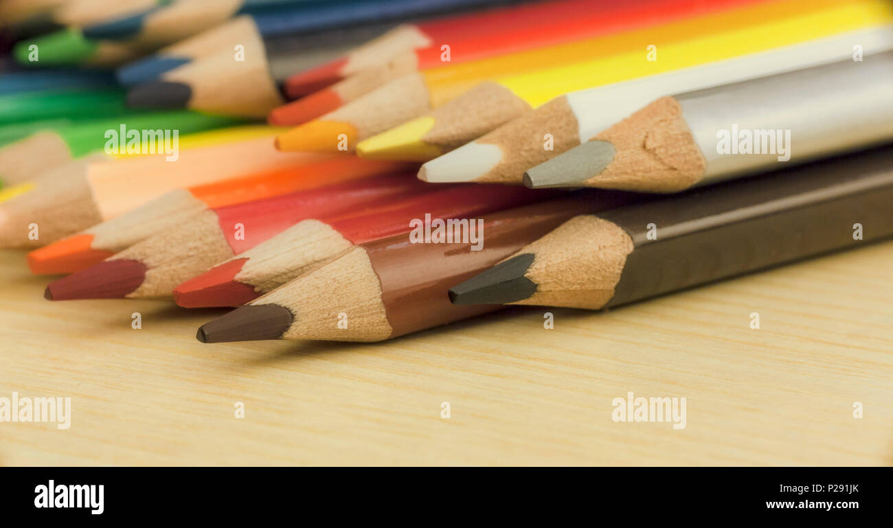 A set of colored pencils over a table. Side view. Concept: back to ...