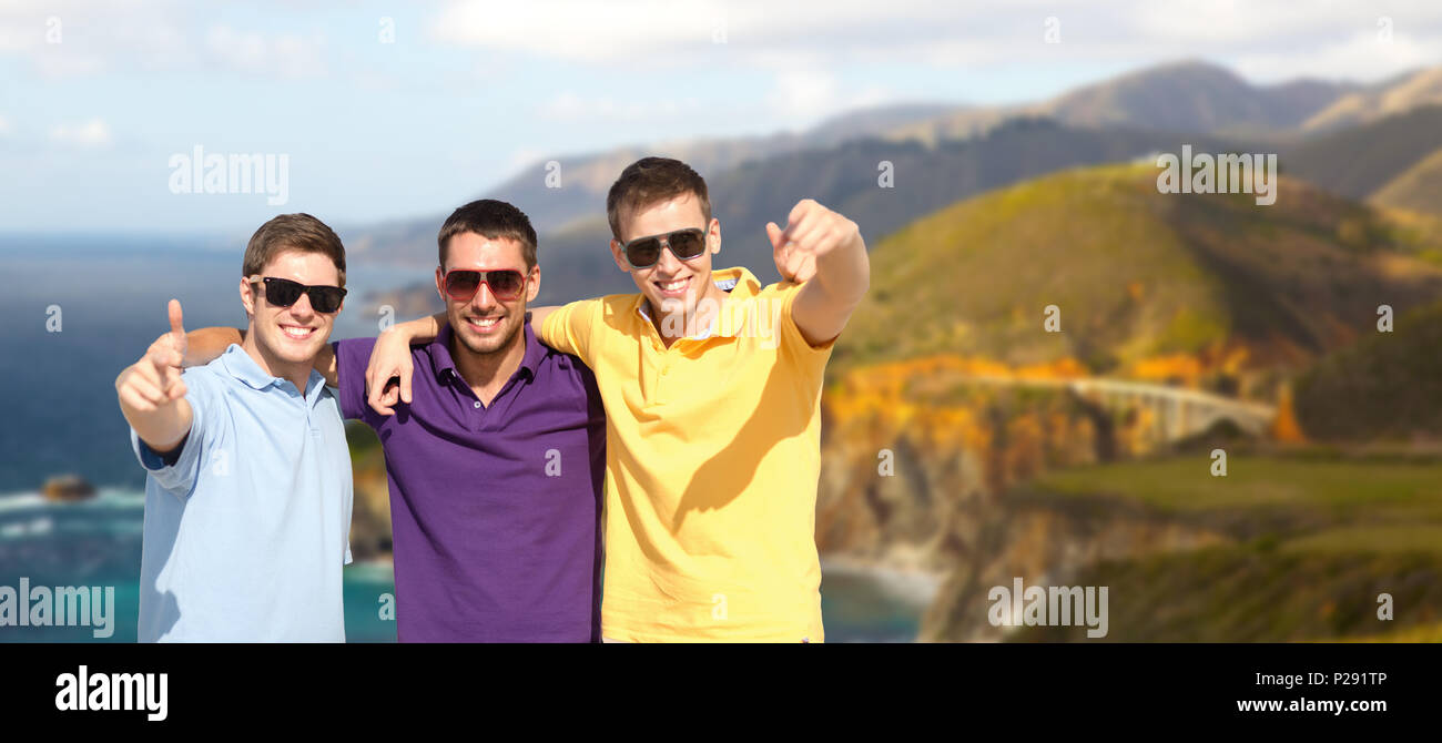 group of male friends hugging over big sur coast Stock Photo - Alamy