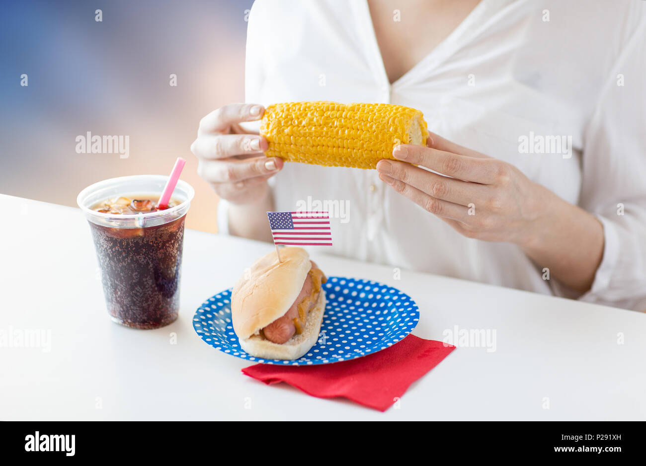 Woman eating corn dog hi-res stock photography and images - Alamy