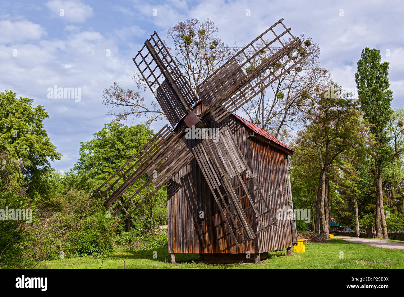 An old wooden mill. Old windmill in the museum of architecture Stock ...