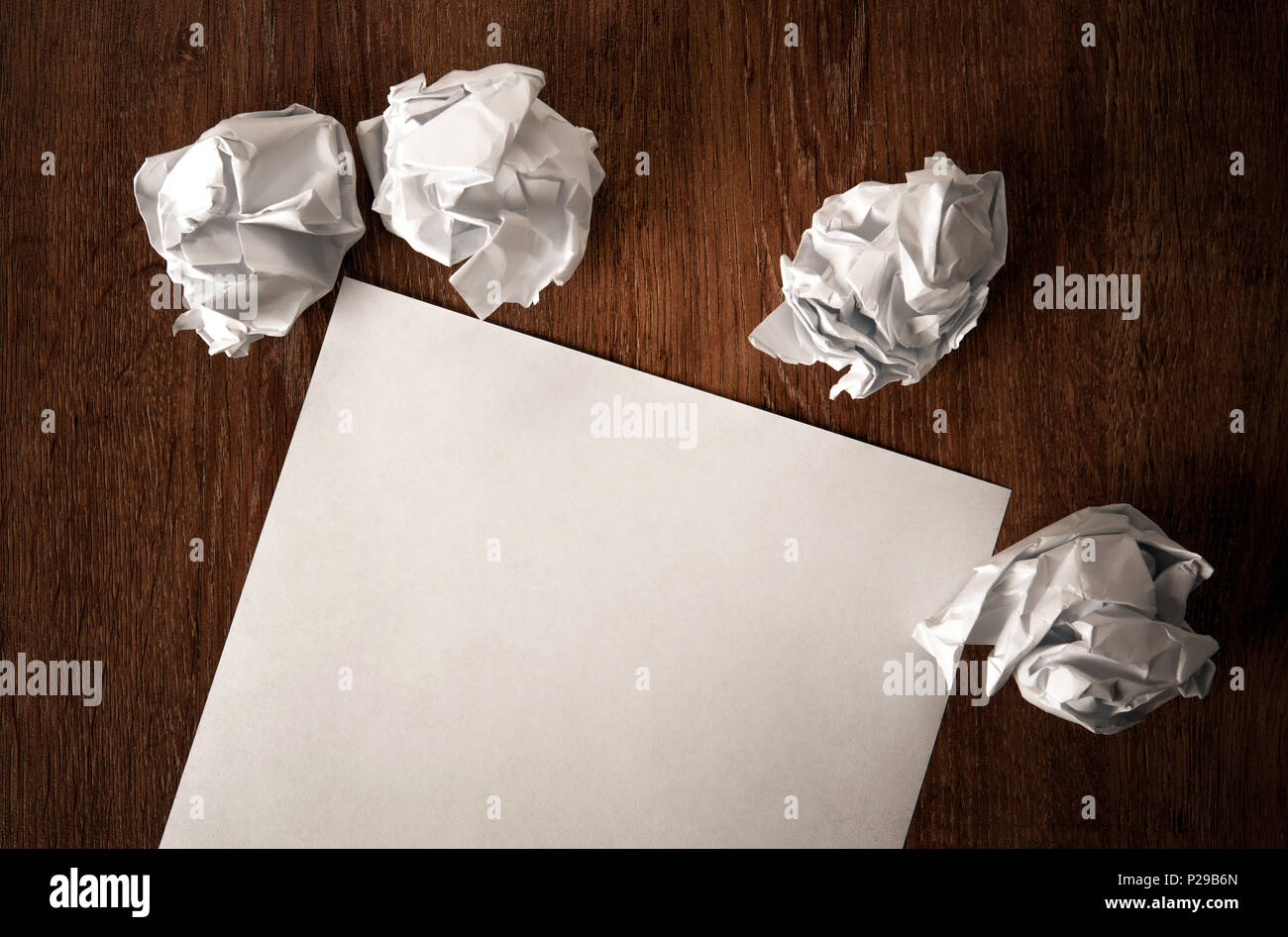 paper and a crumpled paper on a table Stock Photo - Alamy