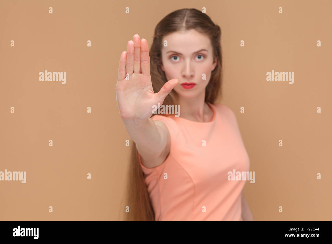 stop it. woman with ban sign looking at camera. portrait of emotional ...