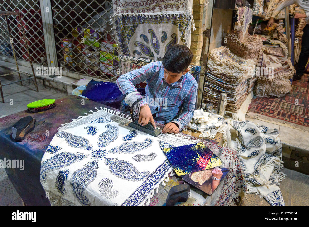 Isfahan, Iran - March 21, 2018: Iranian young boy using carved wooden ...