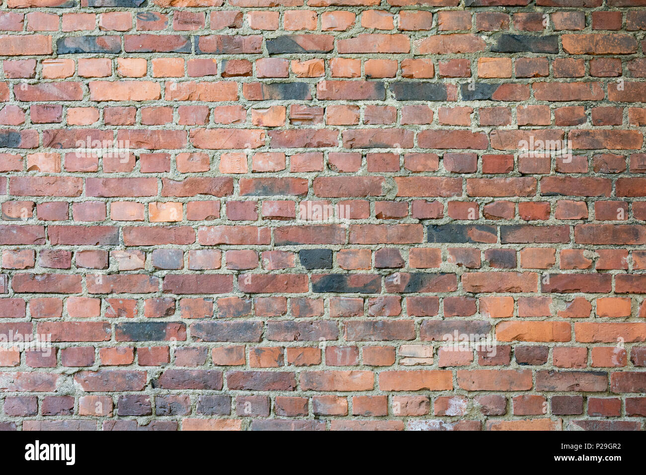Old messy brick wall texture background exterior Stock Photo - Alamy