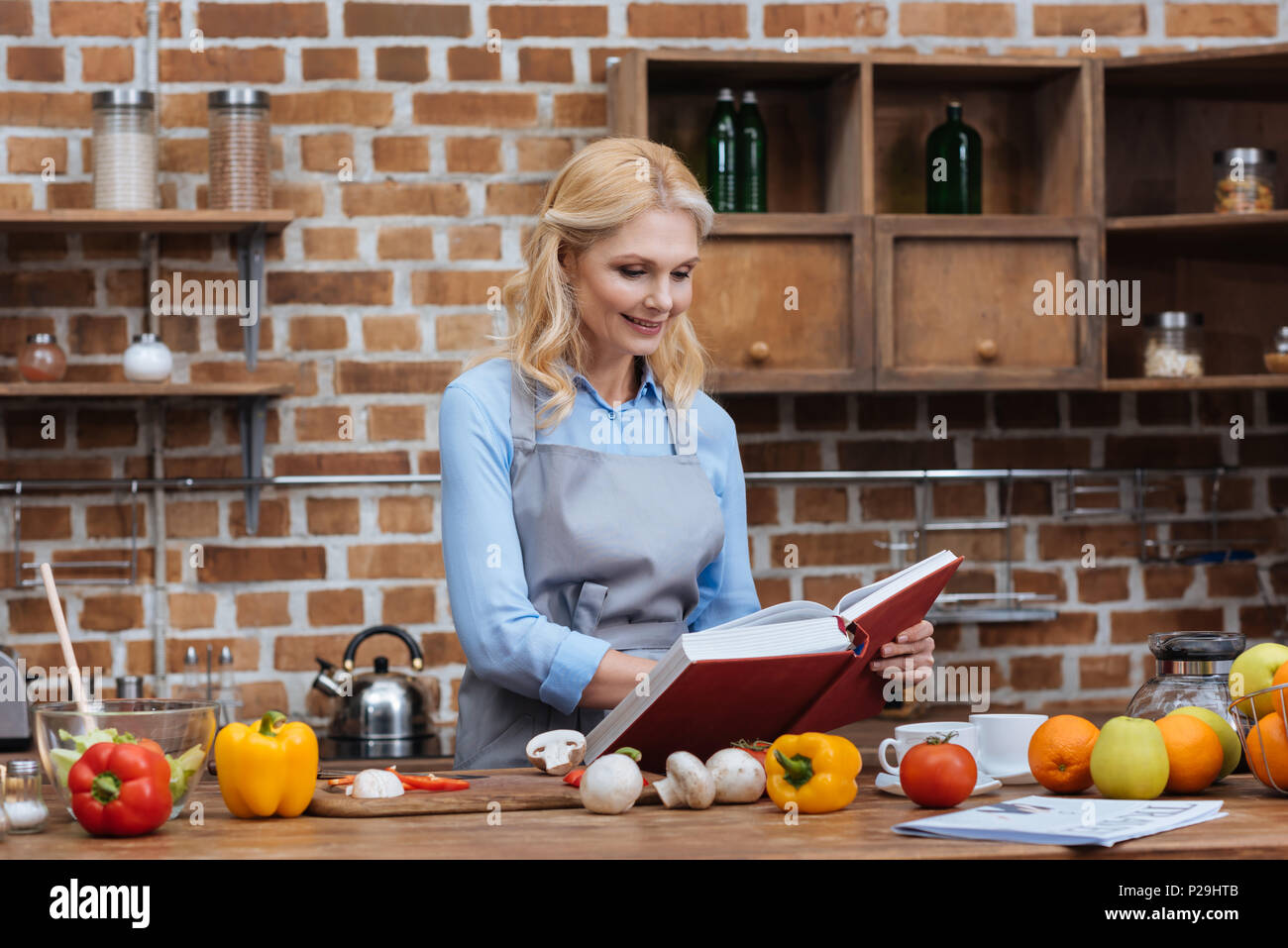 Reading recipe book hi-res stock photography and images - Alamy
