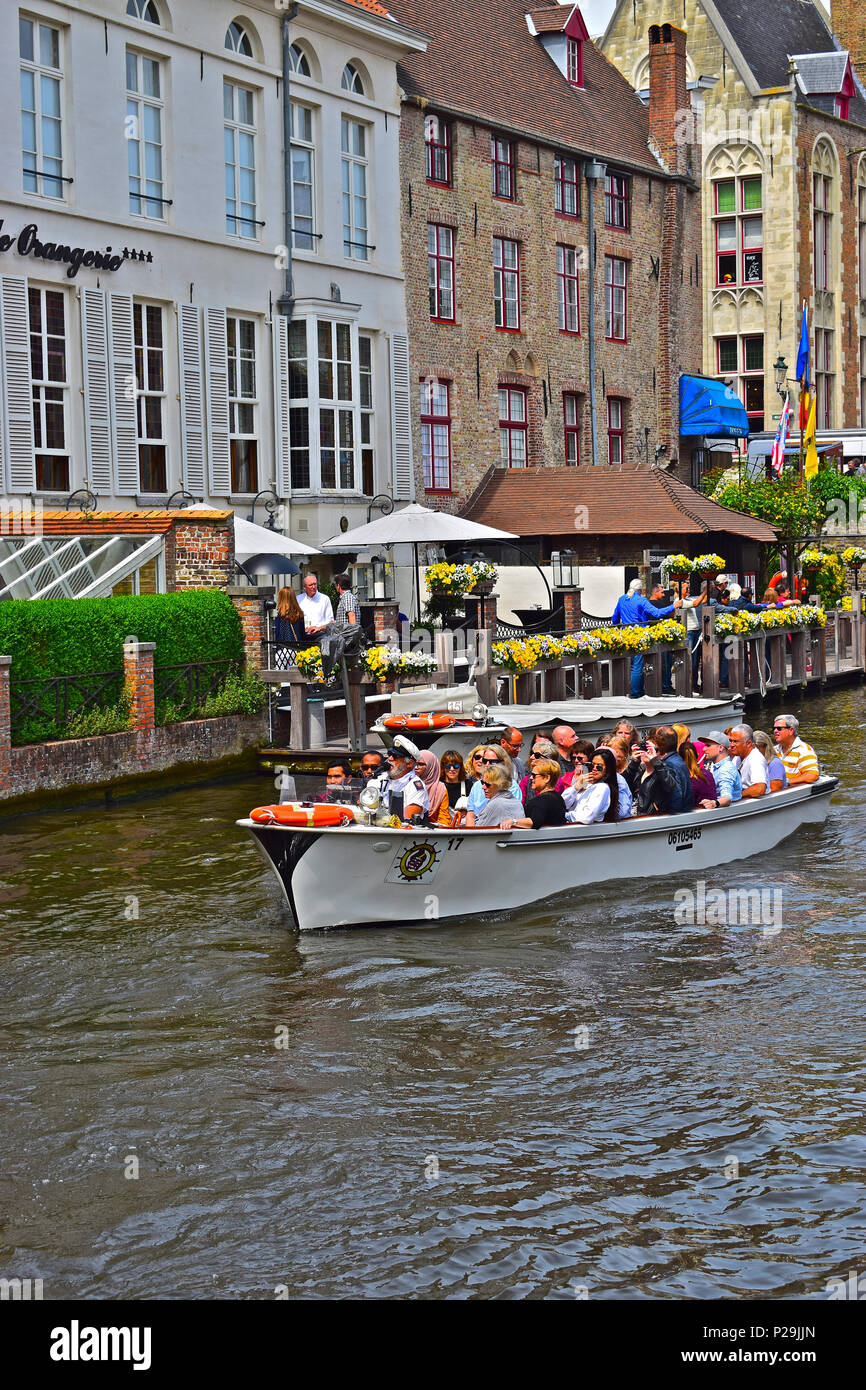 One of the very popular canal boats takes a group of tourists ...