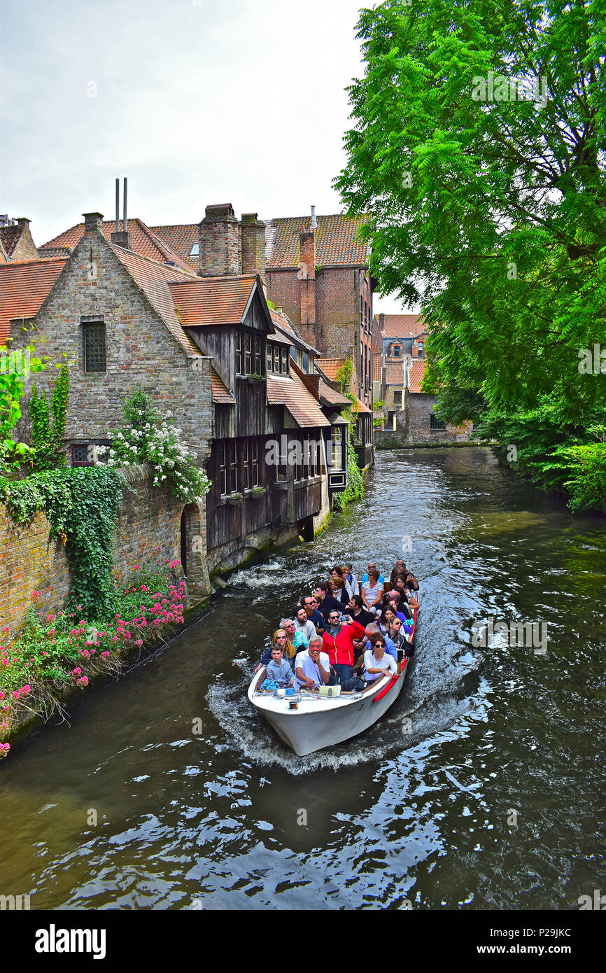 A popular canal tour boat full of tourists approaches the Bonifacius ...