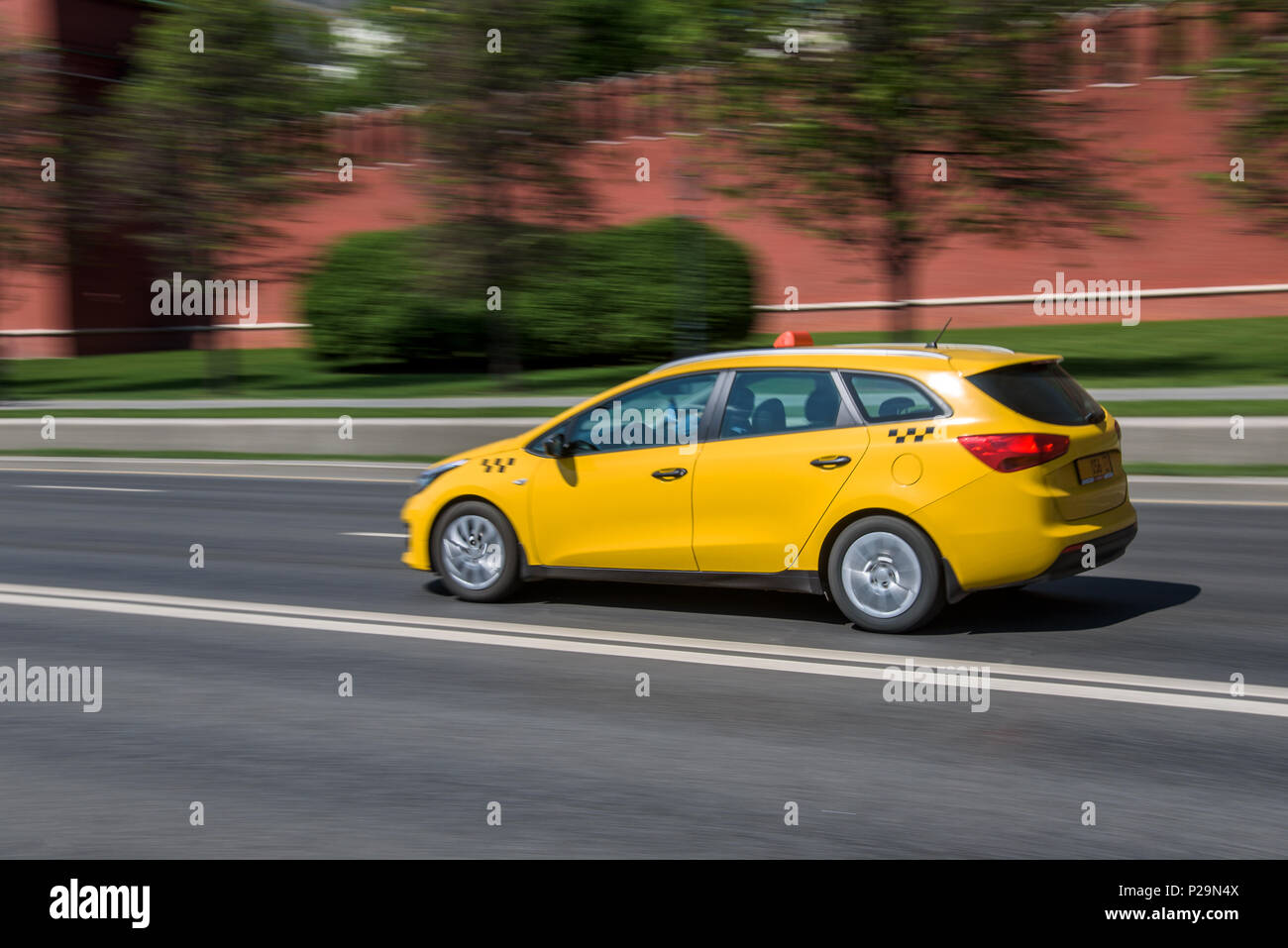 Blurred motion taxi driving city street hi-res stock photography and ...