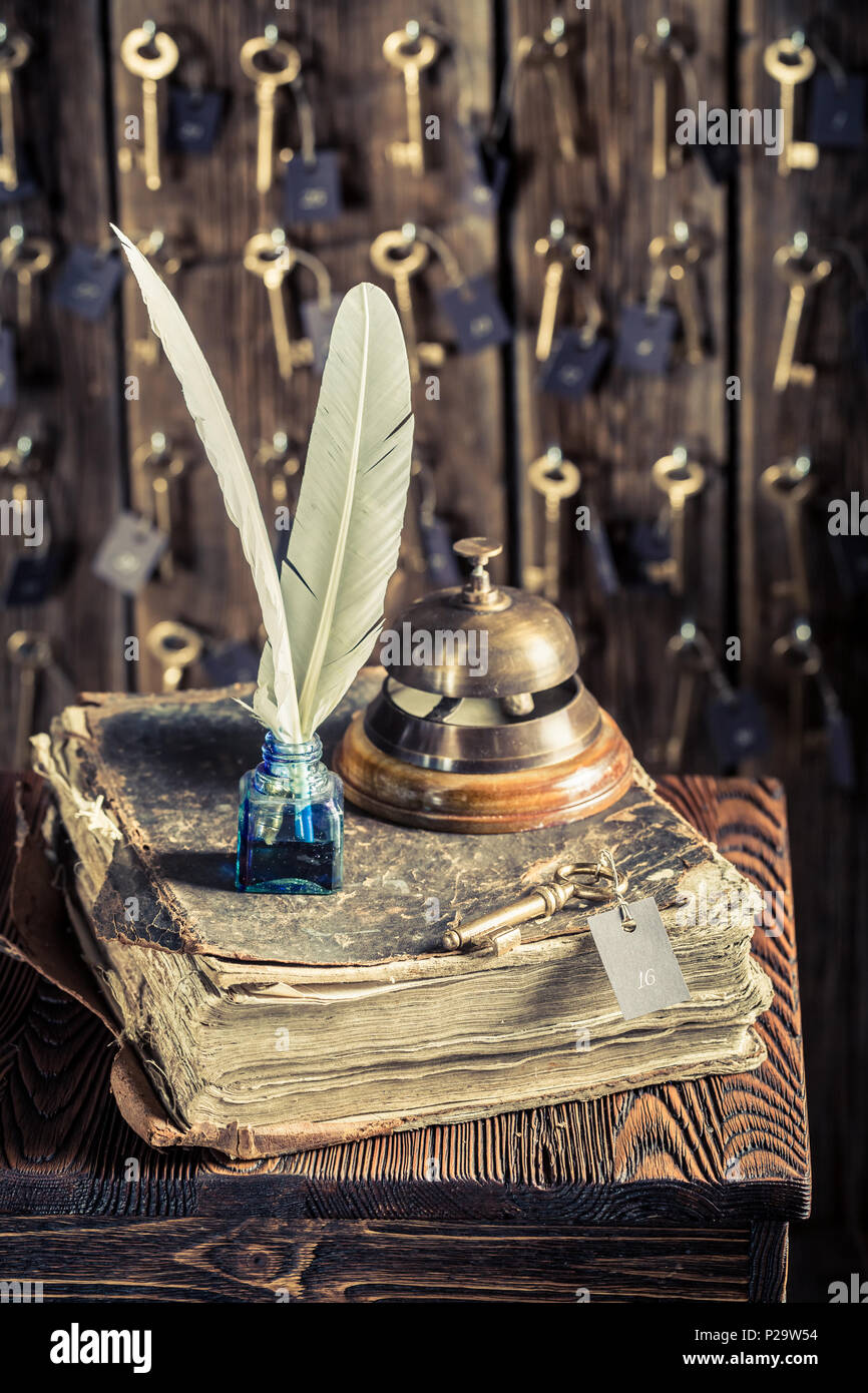 Vintage reception in hotel with guestbook and keys Stock Photo - Alamy