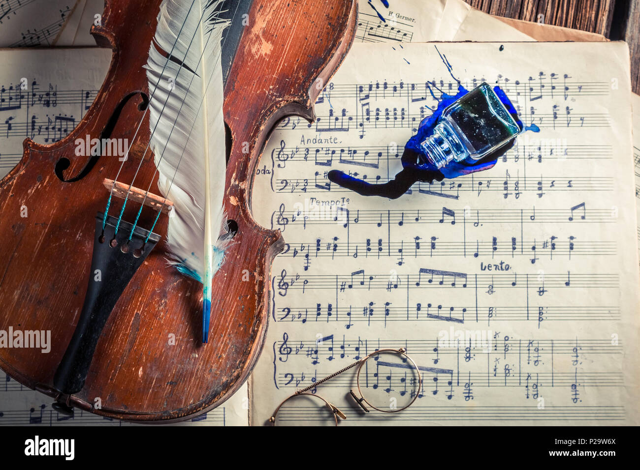 Closeup of vintage sheets, violin and ink with feather Stock Photo - Alamy