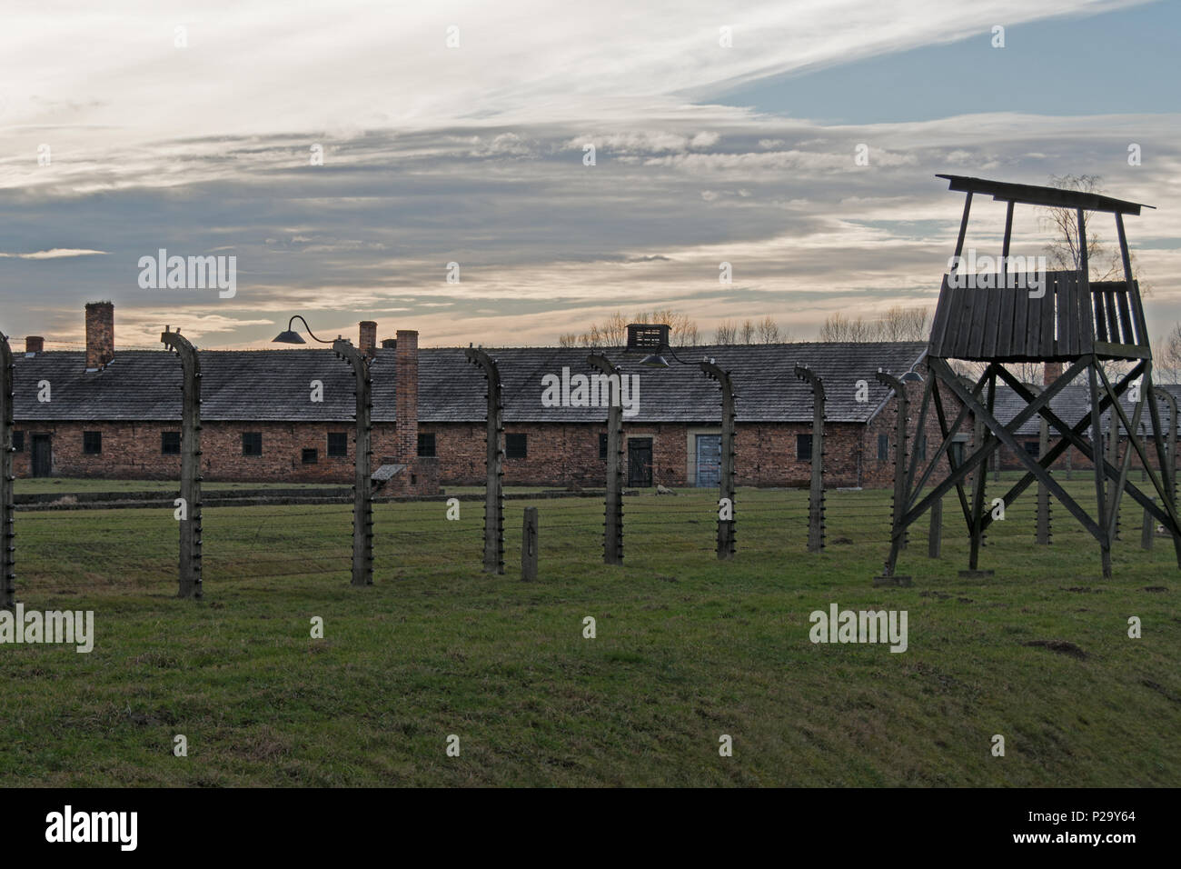 Guard tower sitting along a once electrified fence at Auschwitz ...