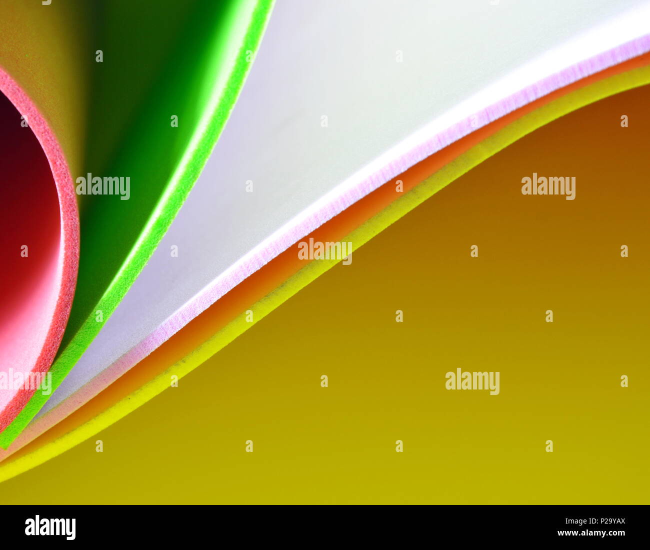 curve of color foam rubber board roll Stock Photo - Alamy
