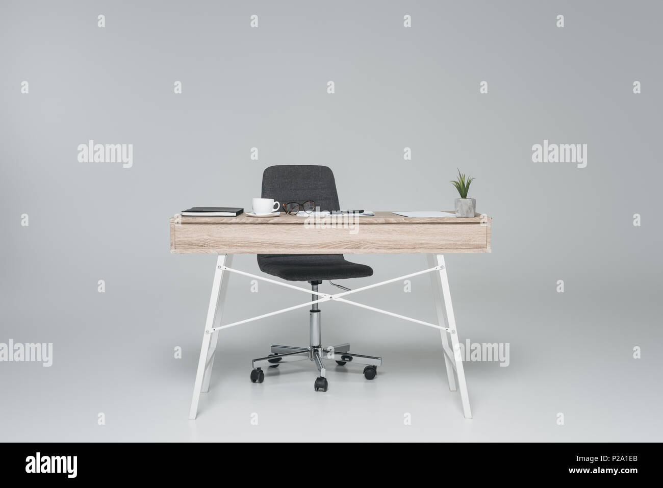 office table with empty chair on gray Stock Photo - Alamy