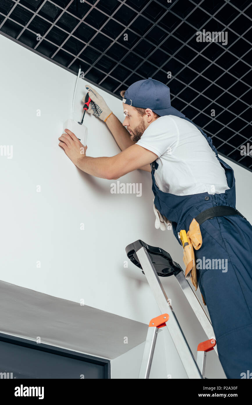 Electrician standing on ladder hi-res stock photography and images - Alamy