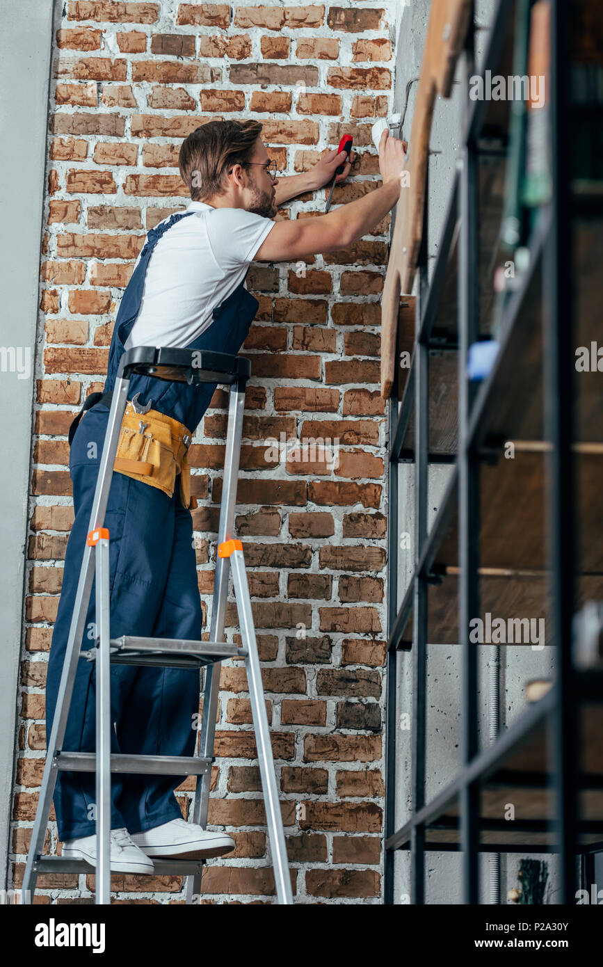 Electrician standing on ladder hi-res stock photography and images - Alamy