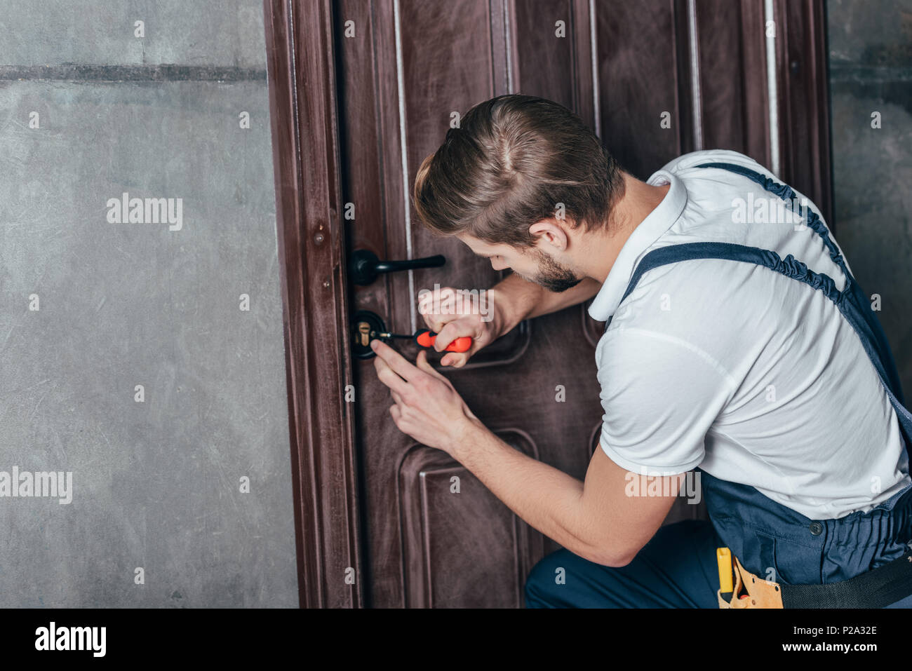 Fixing door lock hi-res stock photography and images - Alamy