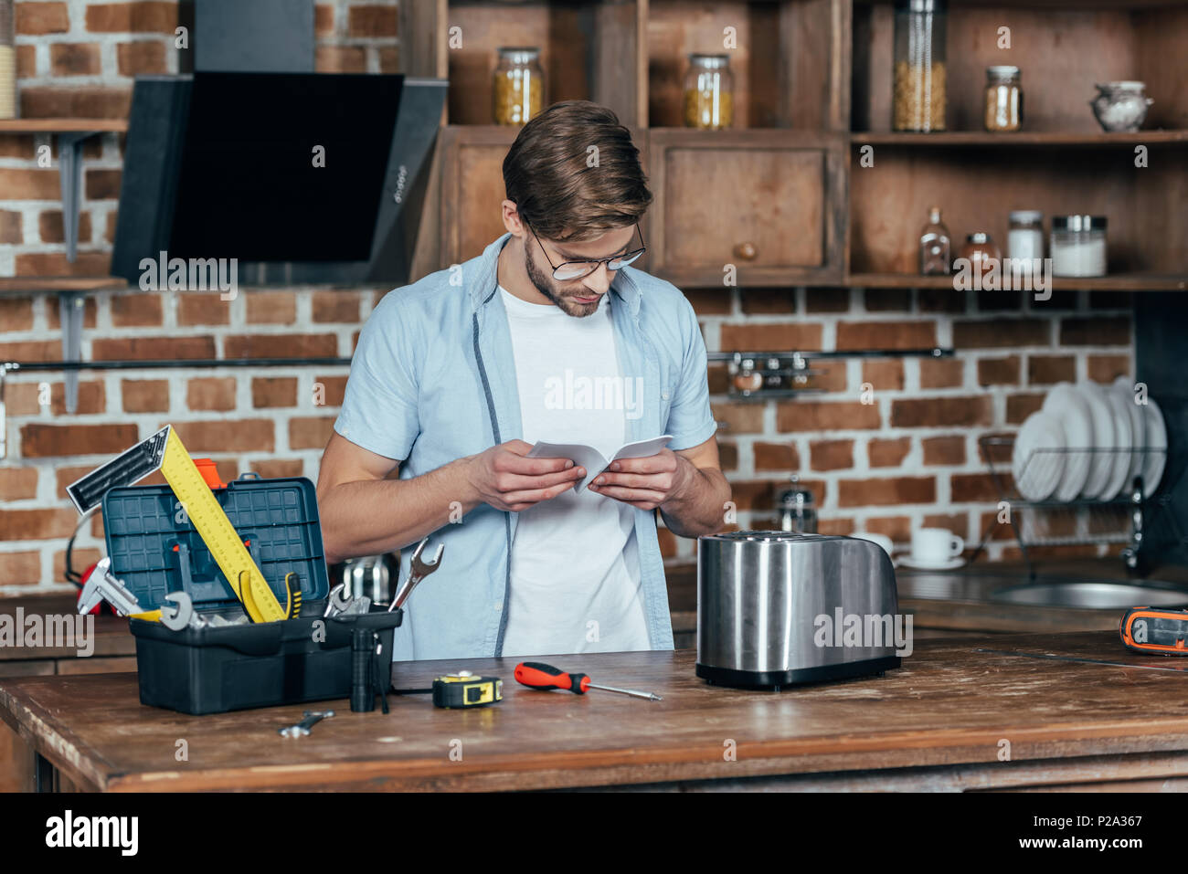 Worker reading manual hi-res stock photography and images - Alamy
