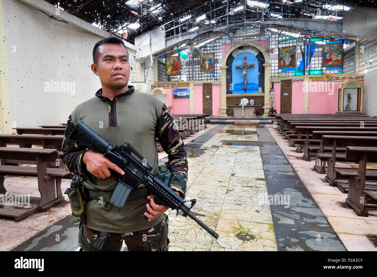 AFP-soldier guarding the ruined catholic cathedral of the devastated ...