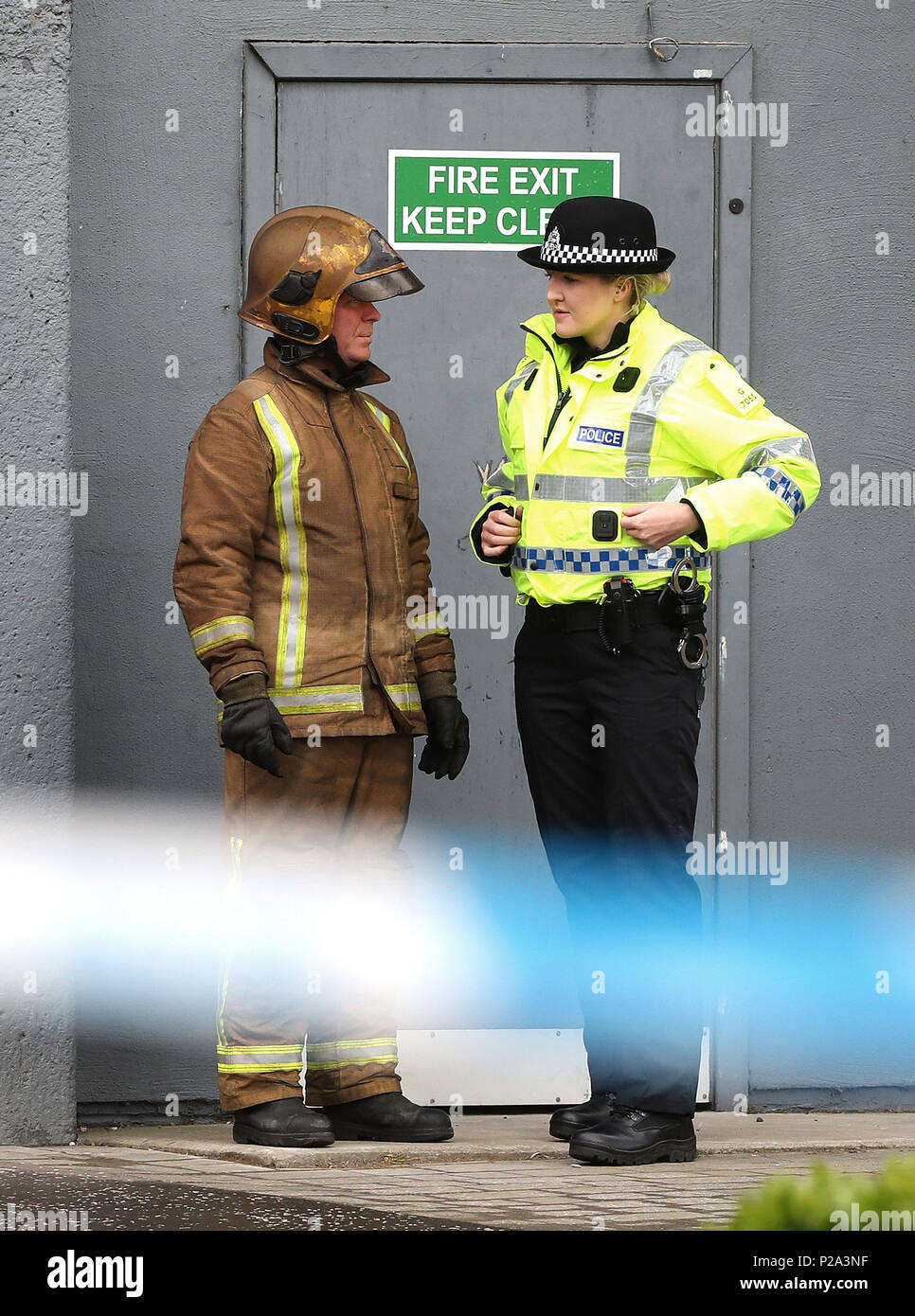 Firemen and police on the scene at Commercial Court in Glasgow after a ...