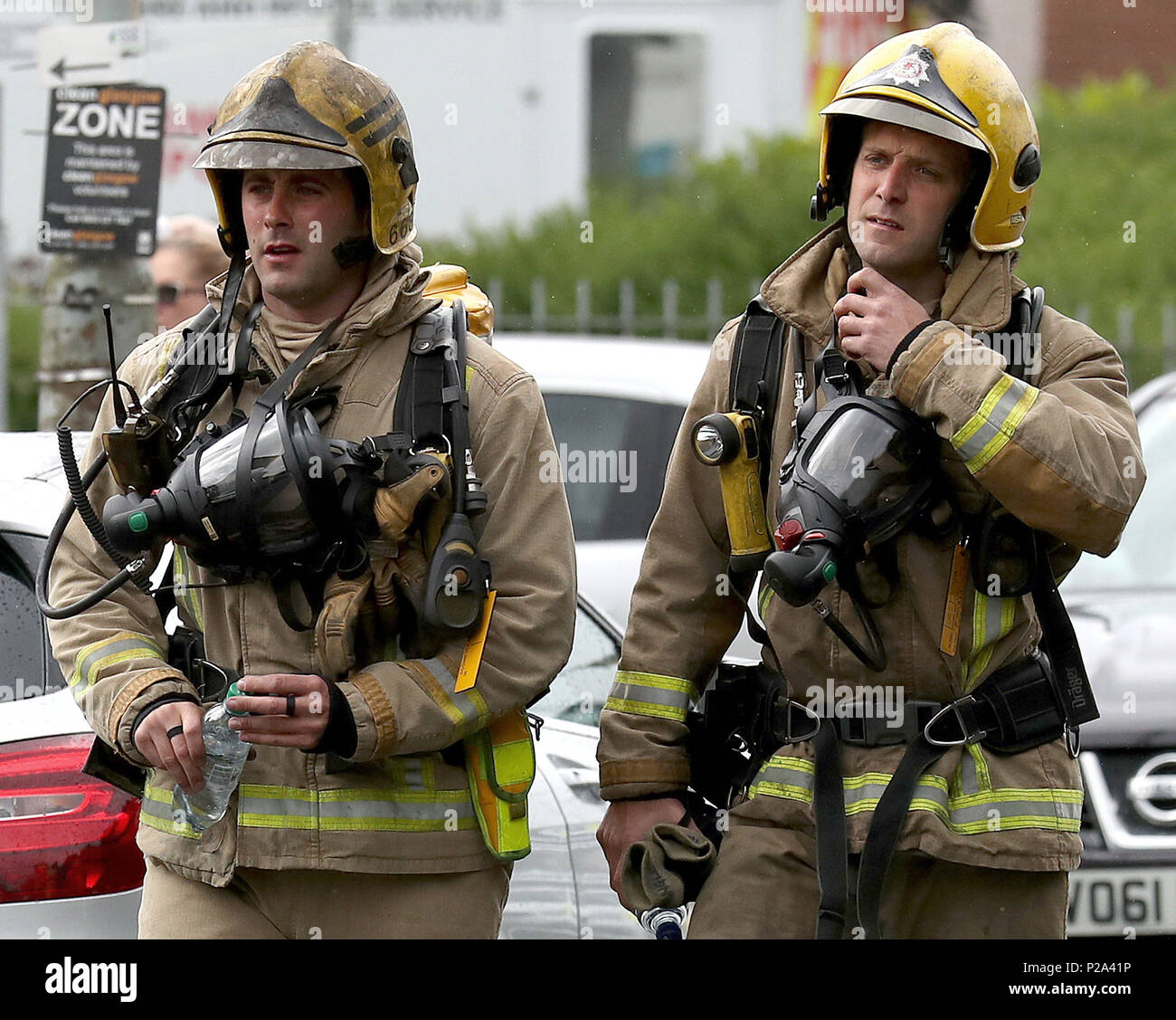 Firemen on the scene at Commercial Court in Glasgow after a fire on the ...