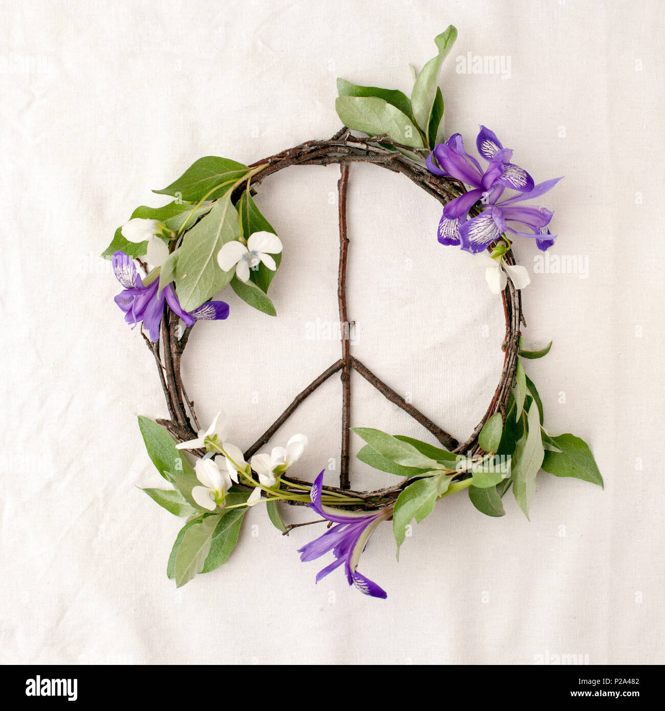 Peace sign, symbol of natural material - flowers, leaves, wooden sticks ...