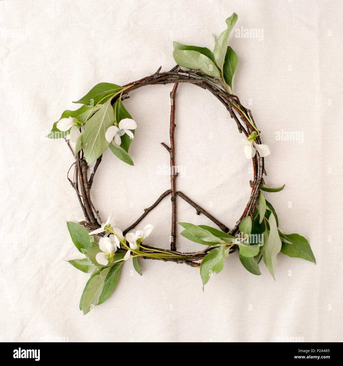 Peace sign, symbol of natural material - flowers, leaves, wooden sticks ...