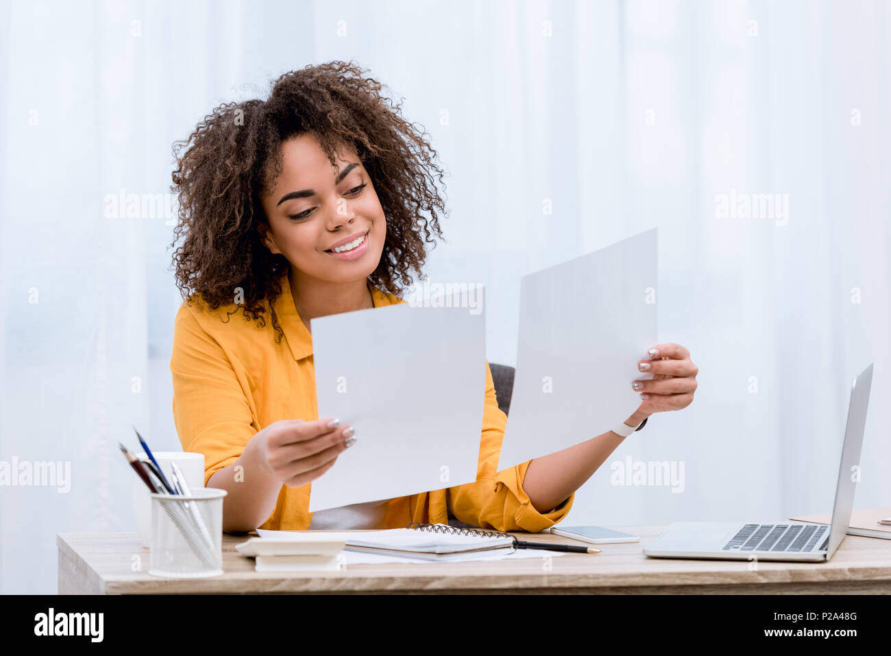 Mixed race people doing paperwork hi-res stock photography and images ...