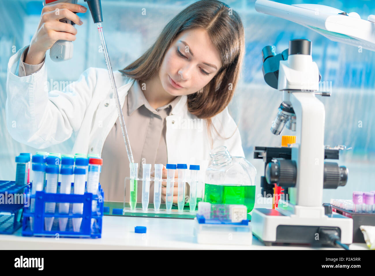Chemical laboratory scientist woman working with pipette Stock Photo ...