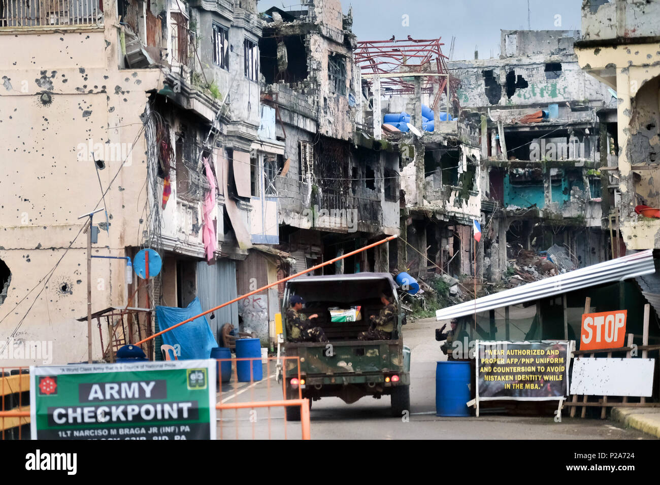 Military post at the entrance to the destroyed center (Ground Zero) of ...