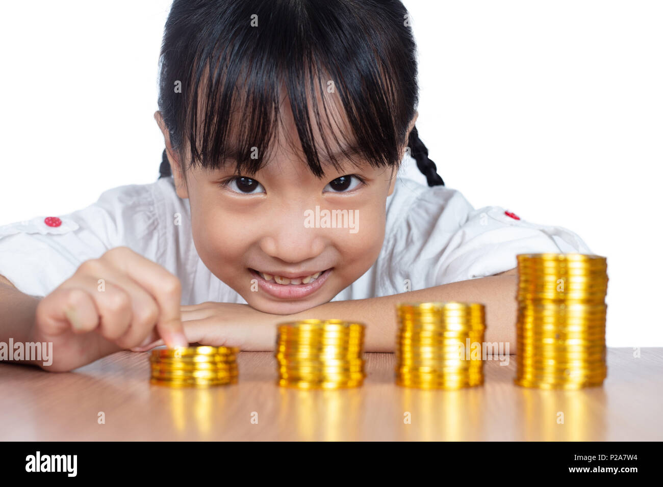 Asian Chinese little girl playing with golden Bitcoin in isolated white ...