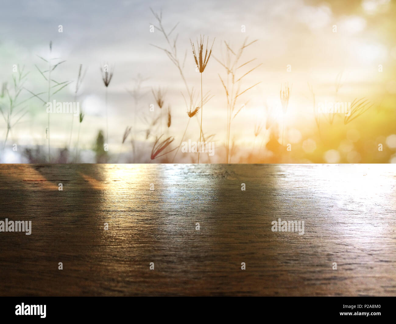 Wooded table and beautiful background montage Stock Photo - Alamy