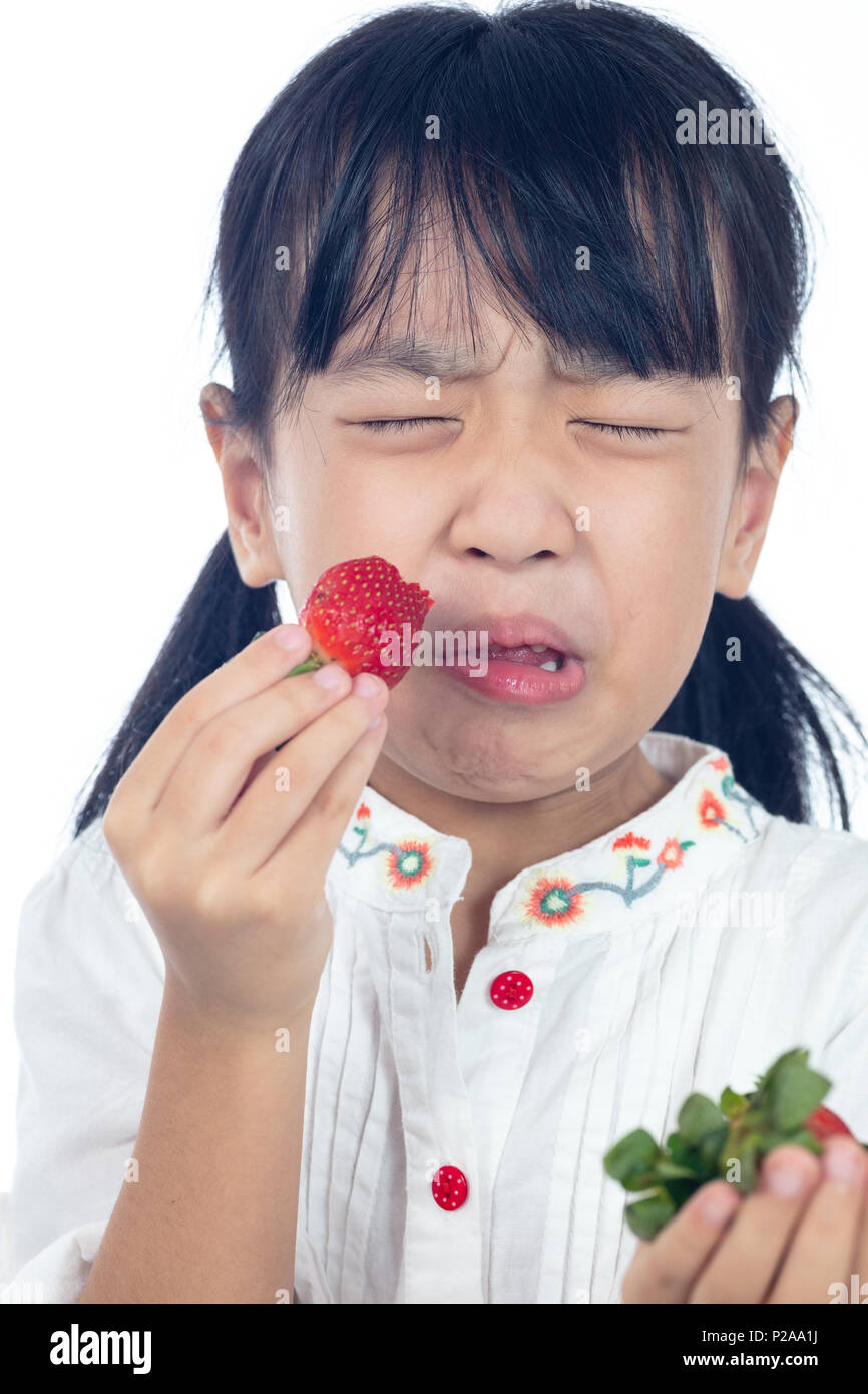 Asian Little Chinese Girl Eating Strawberry in isolated white ...