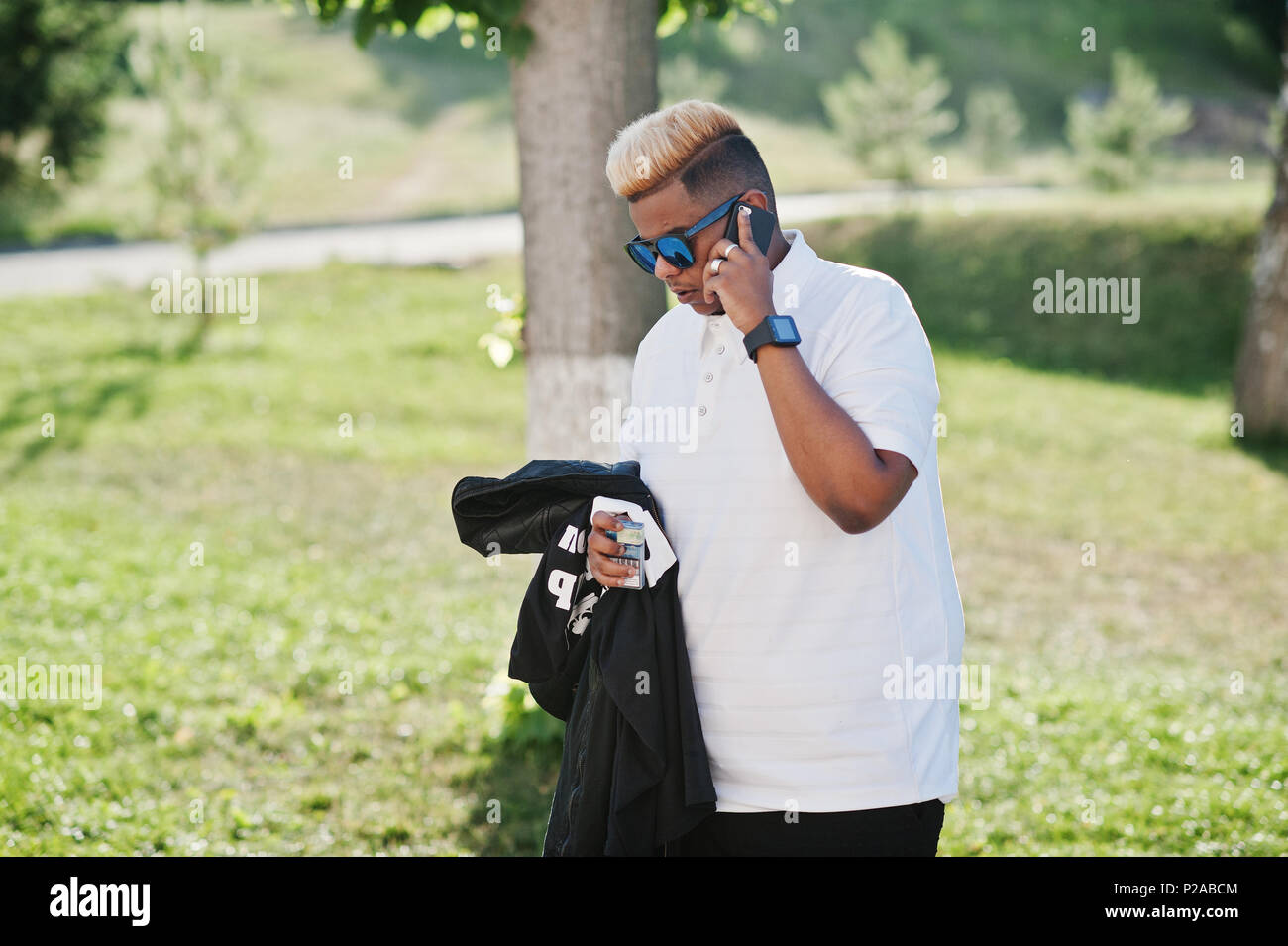 Stylish arabian muslim boy with originally hair posed on streets Stock ...