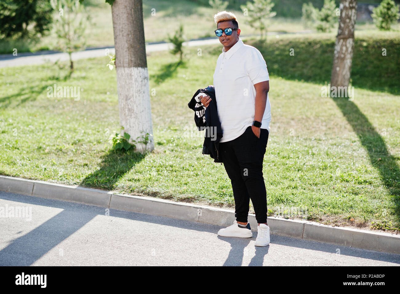 Stylish arabian muslim boy with originally hair posed on streets Stock ...