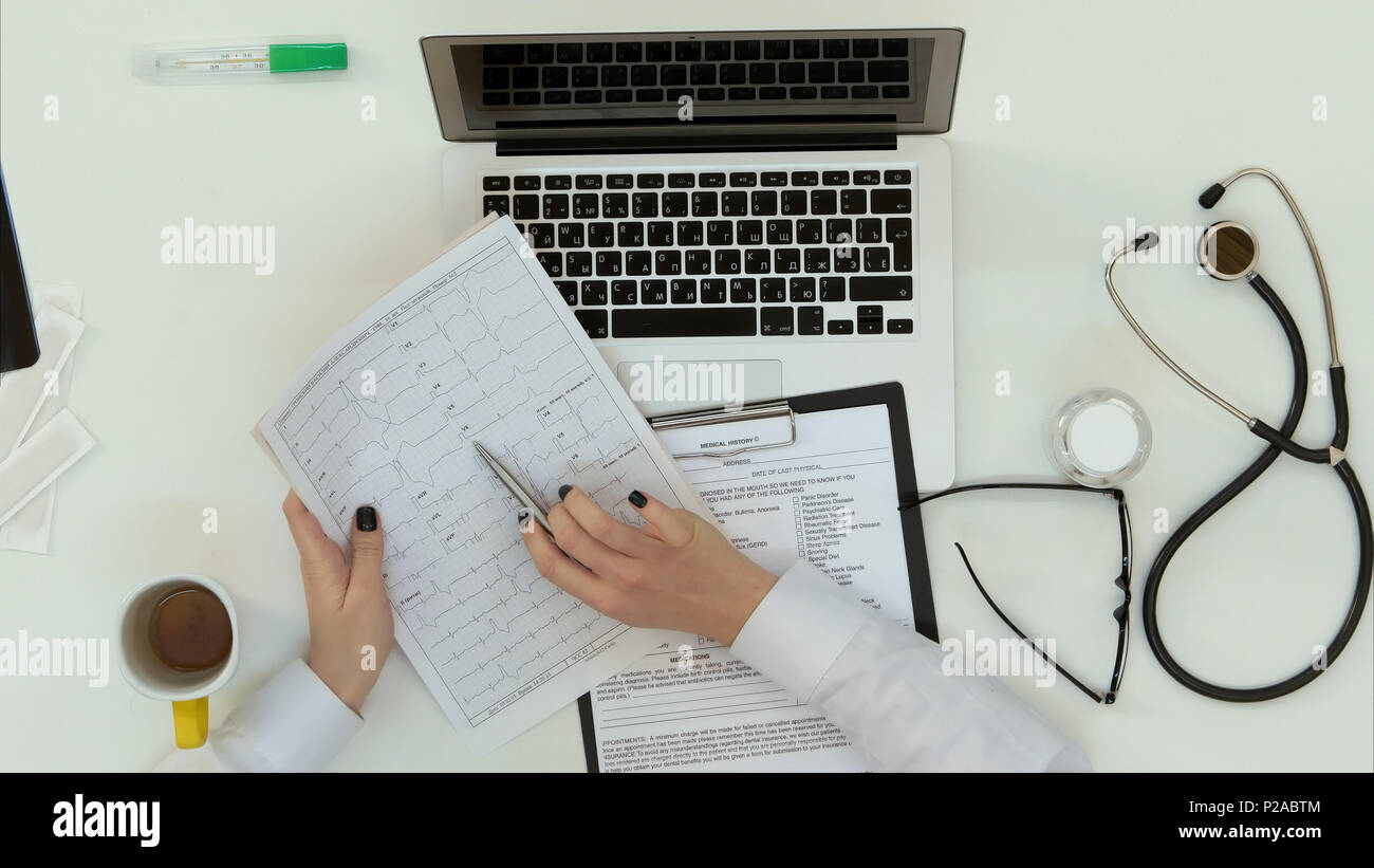Female medicine doctor hands filling patient medical form Stock Photo ...