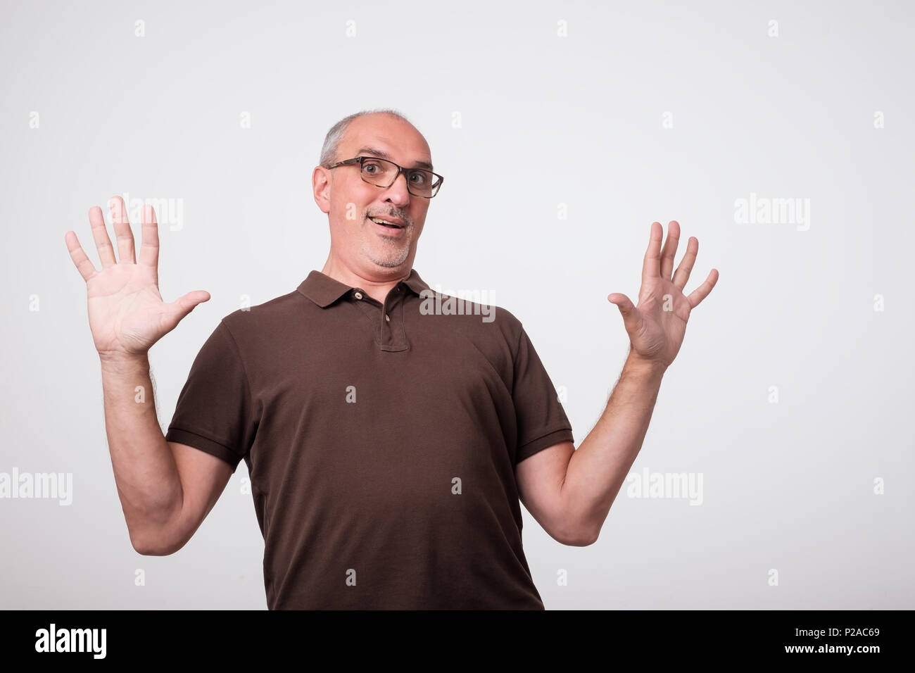 Waving both arms hi-res stock photography and images - Alamy
