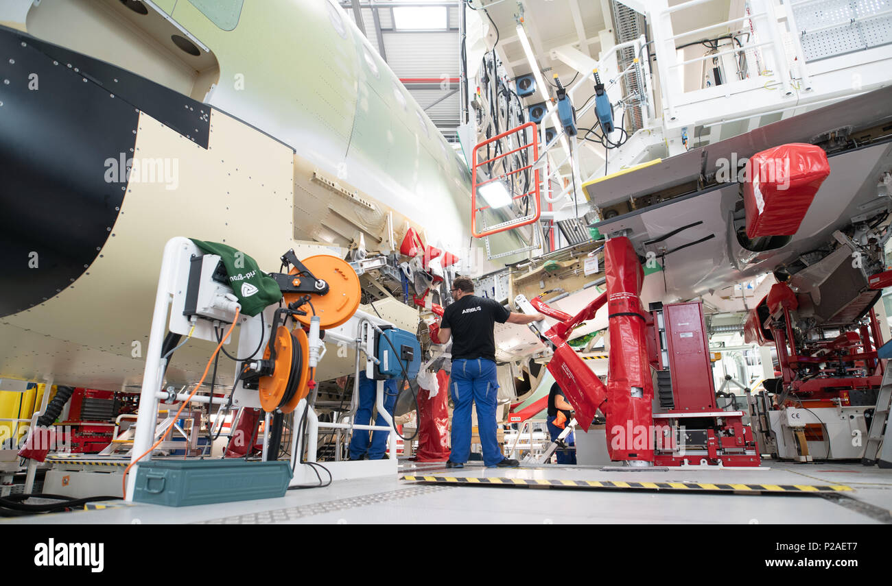 14 June 2018, Hamburg, Germany: An Airbus employee is working on an ...