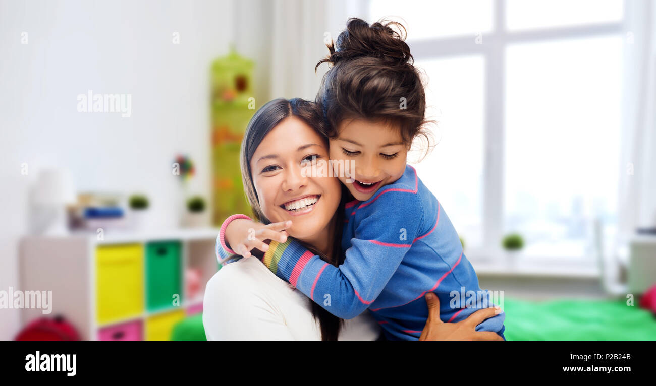 happy mother and daughter hugging at home Stock Photo - Alamy