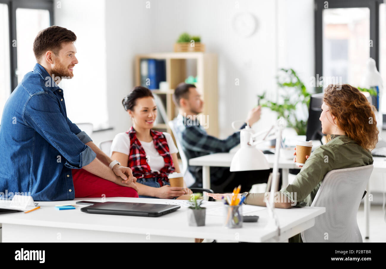 creative team drinking coffee at office Stock Photo - Alamy