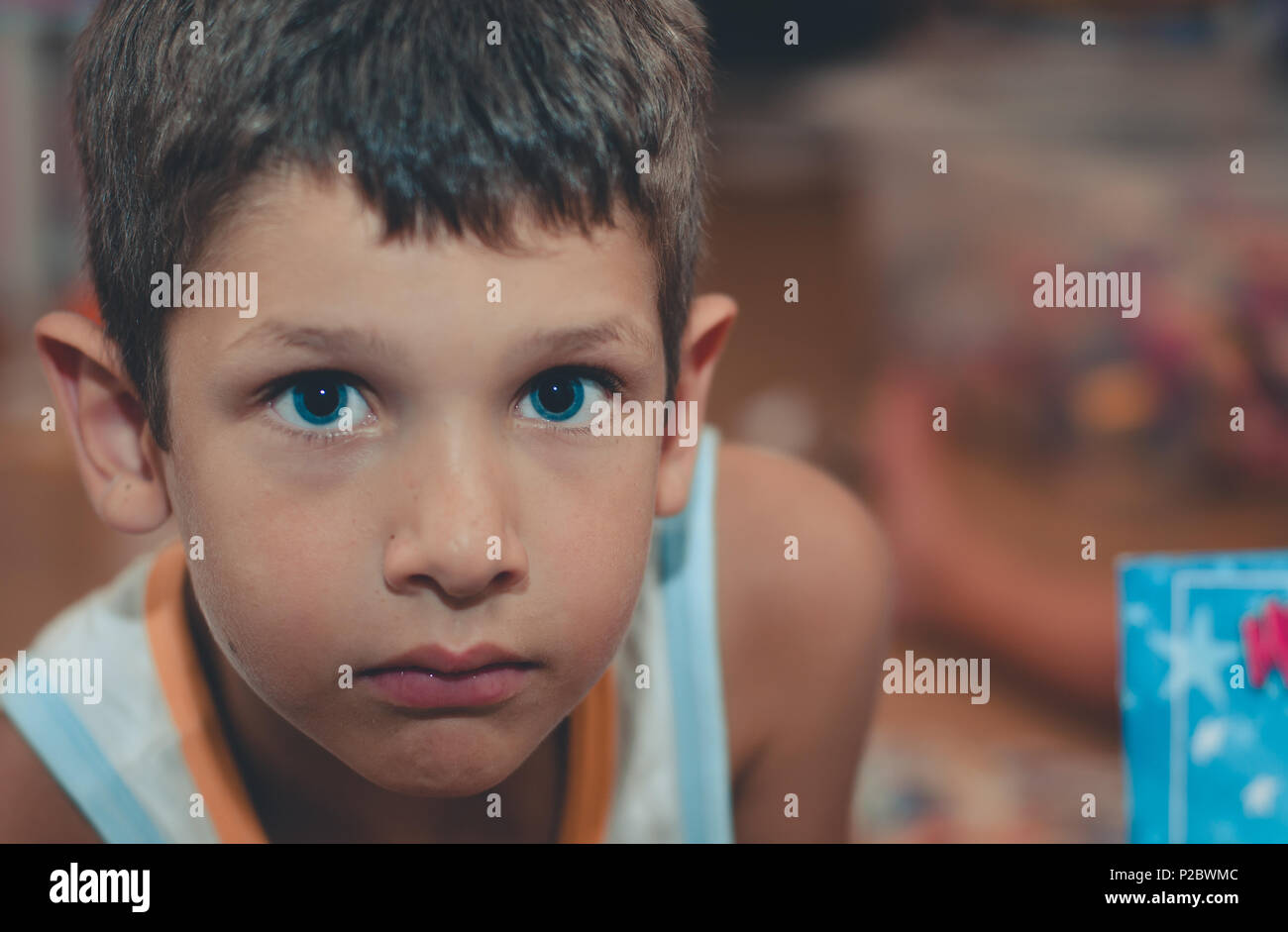 Portrait of kid with blue eyes and with intense stare Stock Photo - Alamy