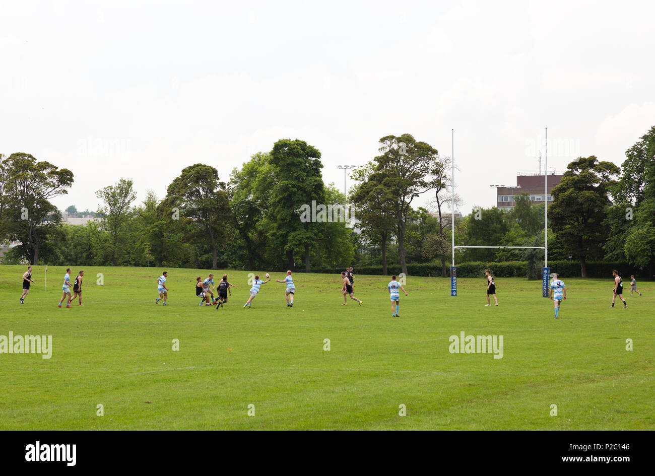 People playing a game of rugby in Inverleith Park, Edinburgh Scotland ...