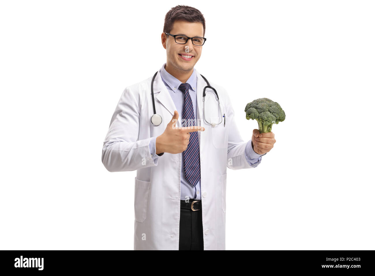 Doctor with broccoli pointing isolated on white background Stock Photo ...