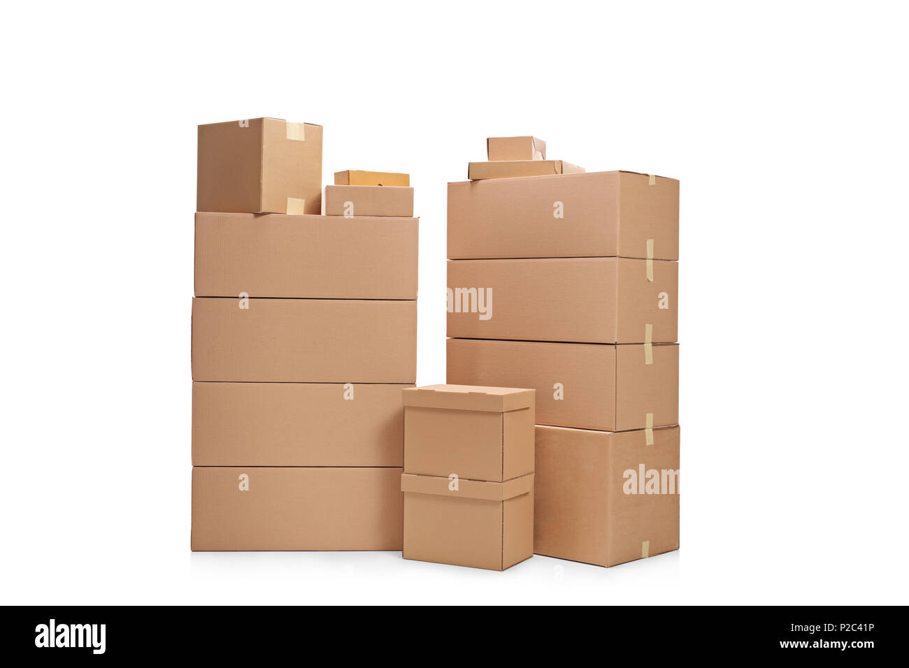 Stacks of cardboard boxes isolated on white background Stock Photo - Alamy