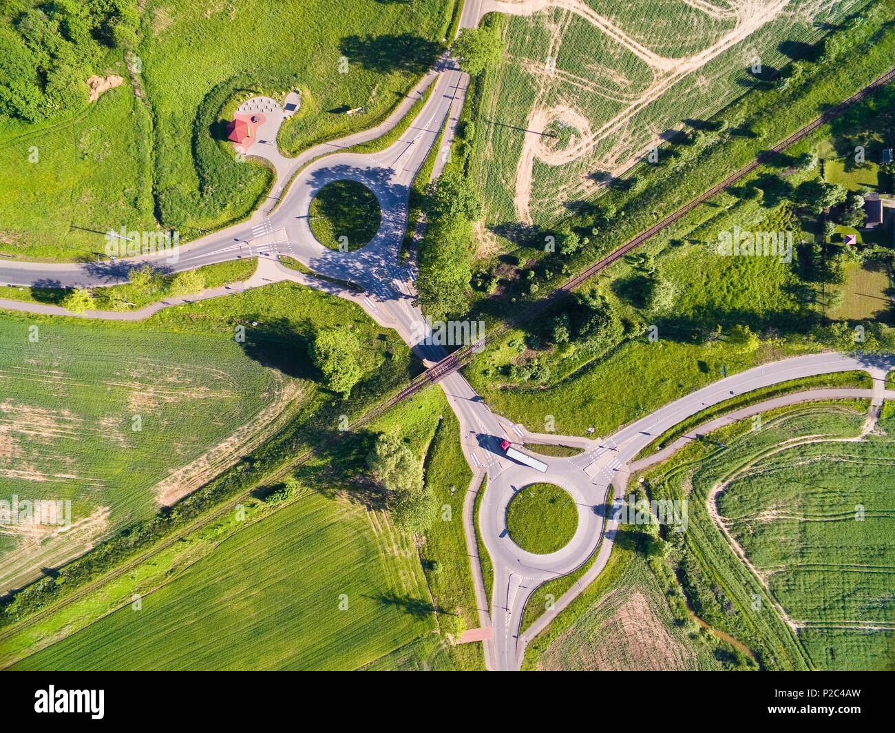 Aerial view of roundabout circles, railroad line and bike lanes, Mazury ...