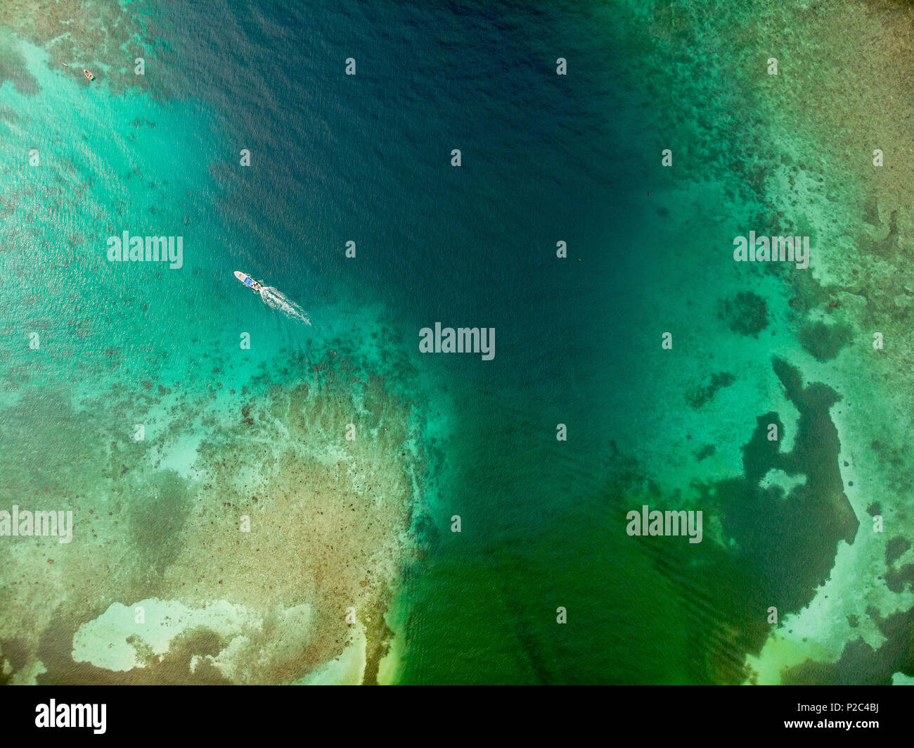 Aerial view of boat over coral reef Stock Photo - Alamy