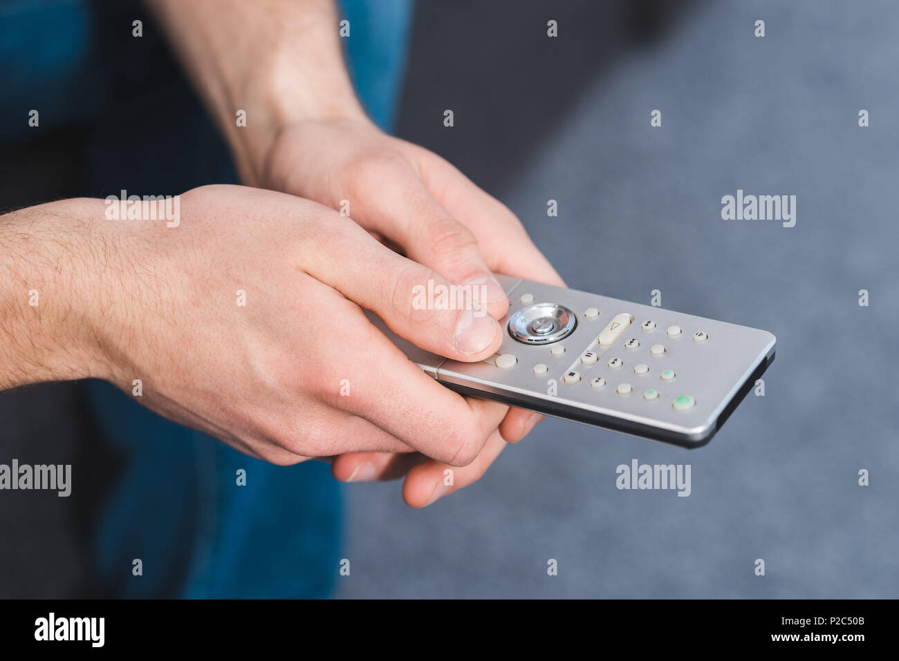 cropped shot of man using remote controller Stock Photo - Alamy
