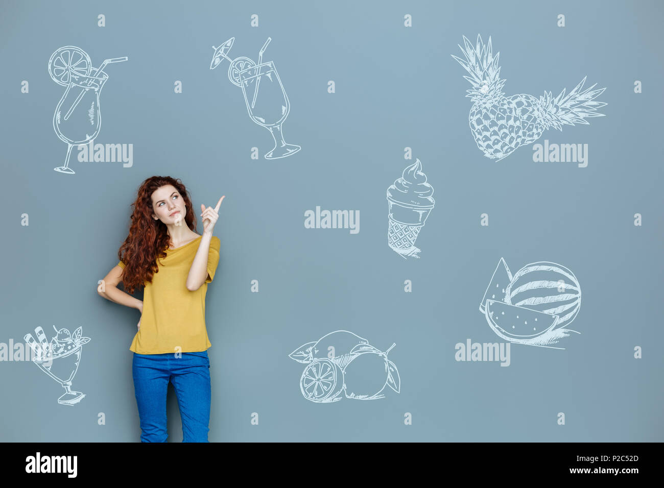 Clever young woman pointing her finger up while talking about healthy ...