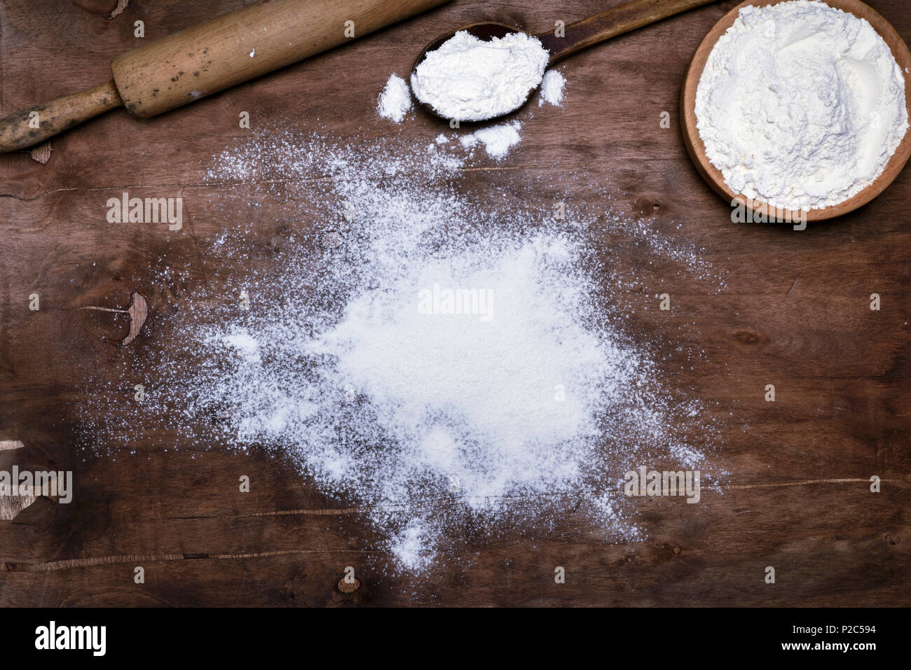 scattered white wheat flour on a brown wooden surface, top view Stock ...